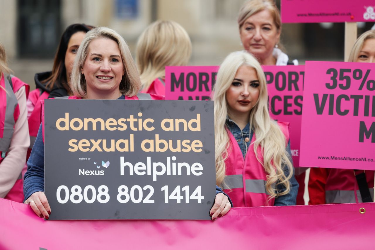 Women march in Belfast to highlight struggles faced by male victims of ...