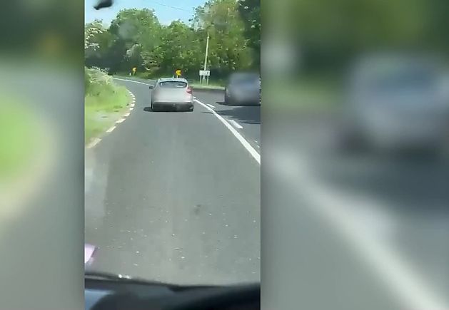 Video footage shows the dramatic moment a car crashes into the wall of ...