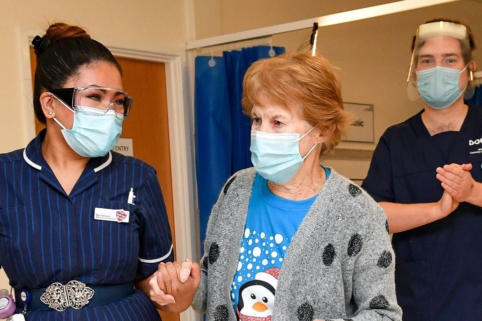Grandmother in world first as Covid-19 vaccinations get under way ...