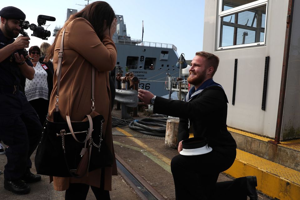 Navy seaman surprises girlfriend with proposal after eight months in ...